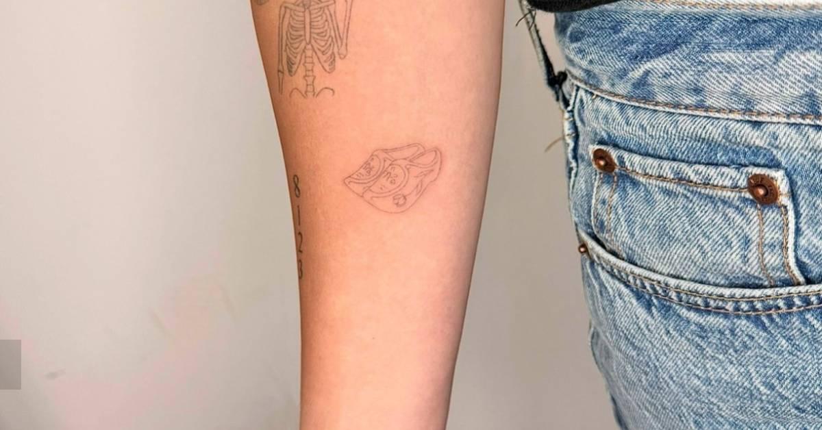 Fine line style clogs tattoo located on the inner