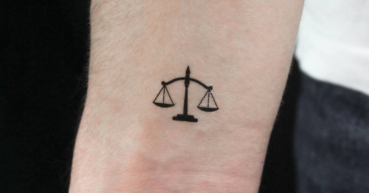 Scale temporary tattoo located on the wrist.