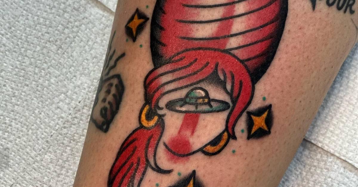 Kate Pierson tattoo located on the shin, done in