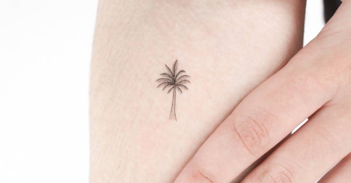 Fine line palm tree temporary tattoo located on the