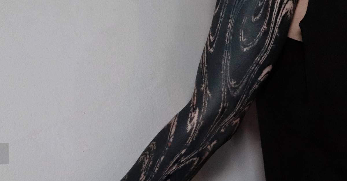 Blackwork style abstract cover-up tattoo sleeve.