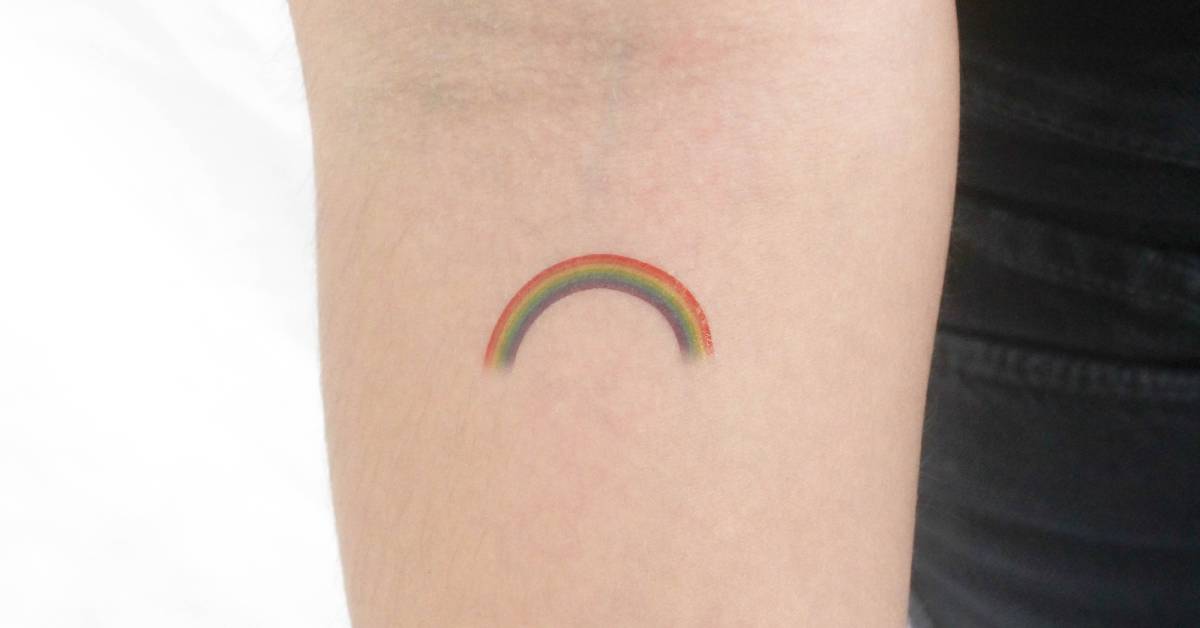 Color rainbow temporary tattoo located on the inner