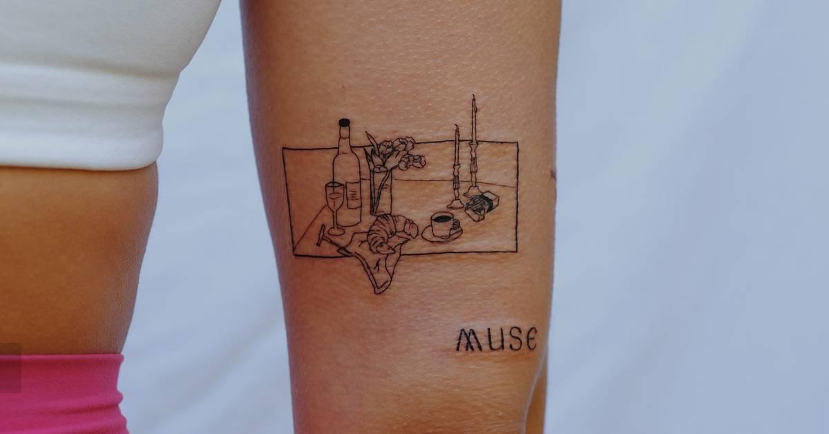 Fine line style still life tattoo located on the