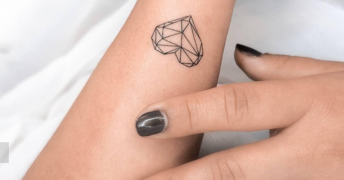 Low poly heart tattoo located on the wrist.