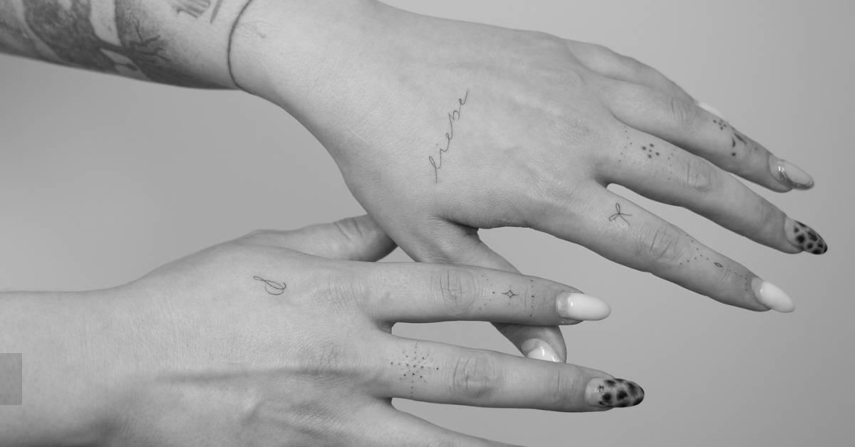 Ornamental finger composition tattoos in fine line