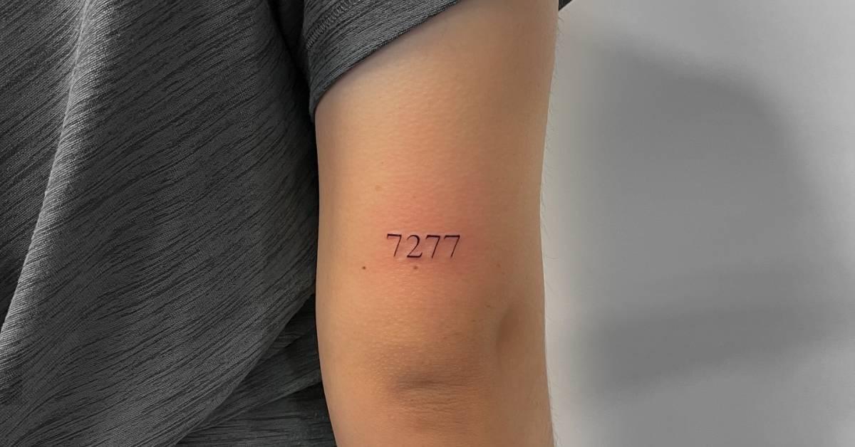 Tattoo of the number "7277" in serif font located on