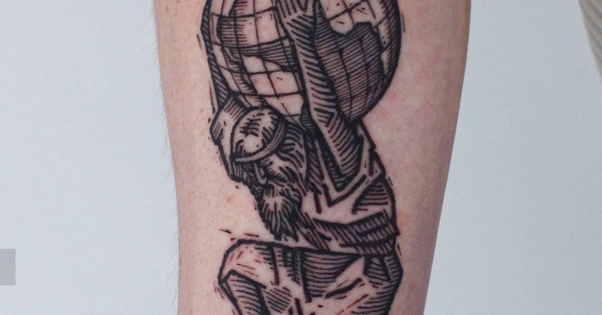 Engraving style Atlas tattoo located on the inner