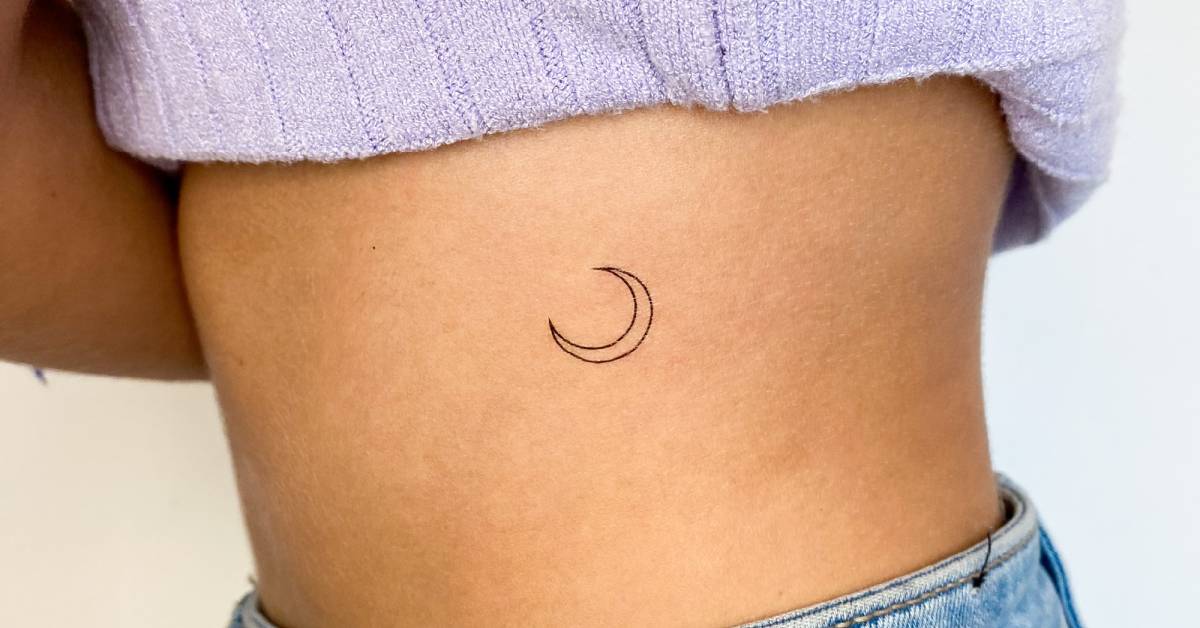 Fine line crescent moon temporary tattoo located on the
