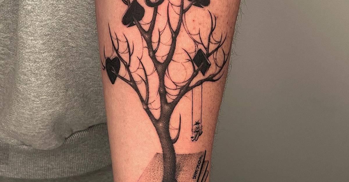 Joker Tree tattoo in dotwork style located on the inner
