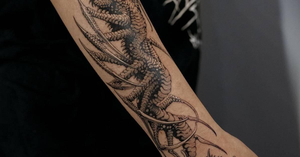 Monster tattoo in comic style located on the forearm.