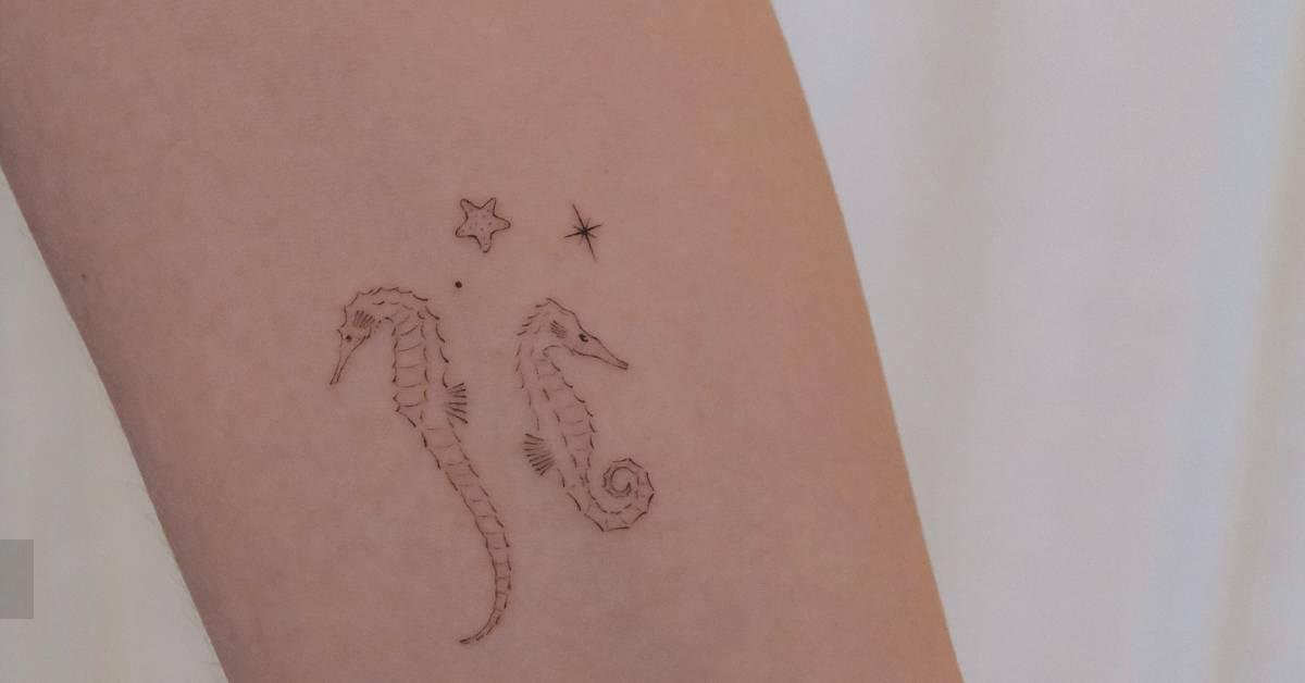 Seahorses tattoo in fine line style done on the inner