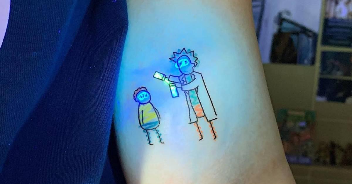 UV ink Rick and Morty tattoo done on the bicep.