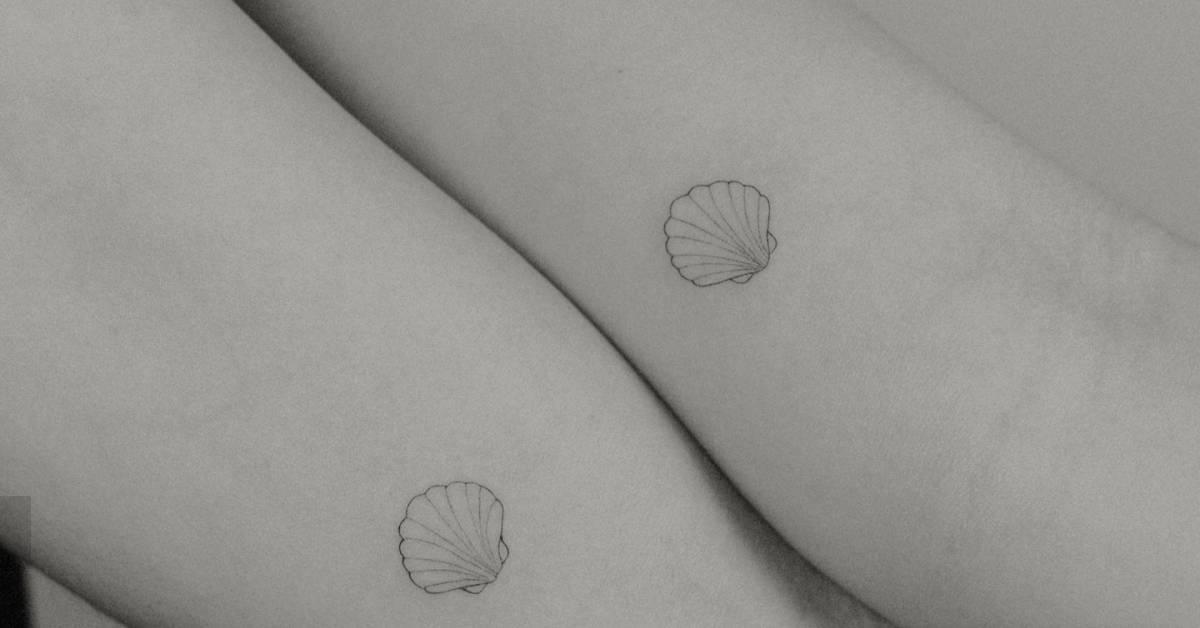 Matching fine line scallop shell tattoo for best
