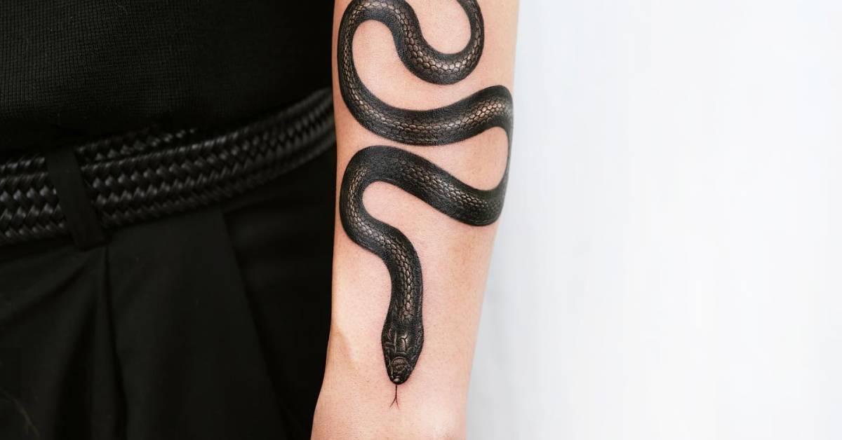 Micro-realistic style snake tattoo done on the forearm.