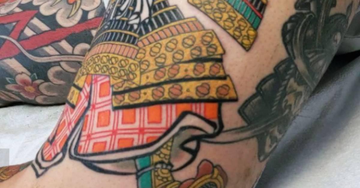 Neo Japanese samurai tattoo on the thigh.