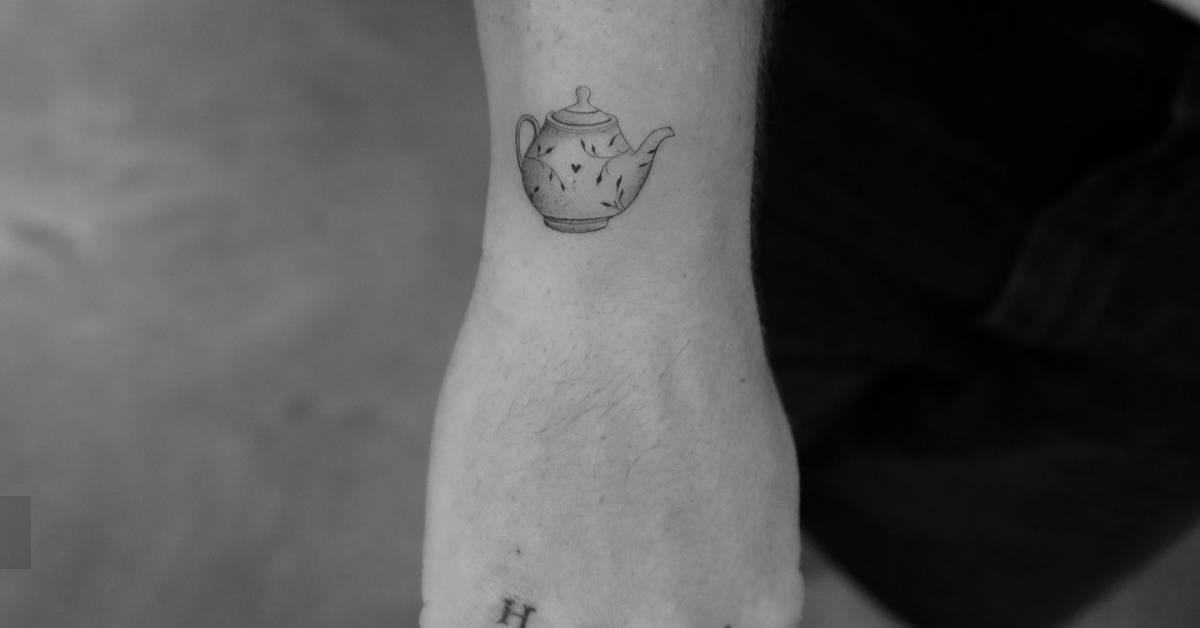 Small illustrative style teapot tattoo located on the