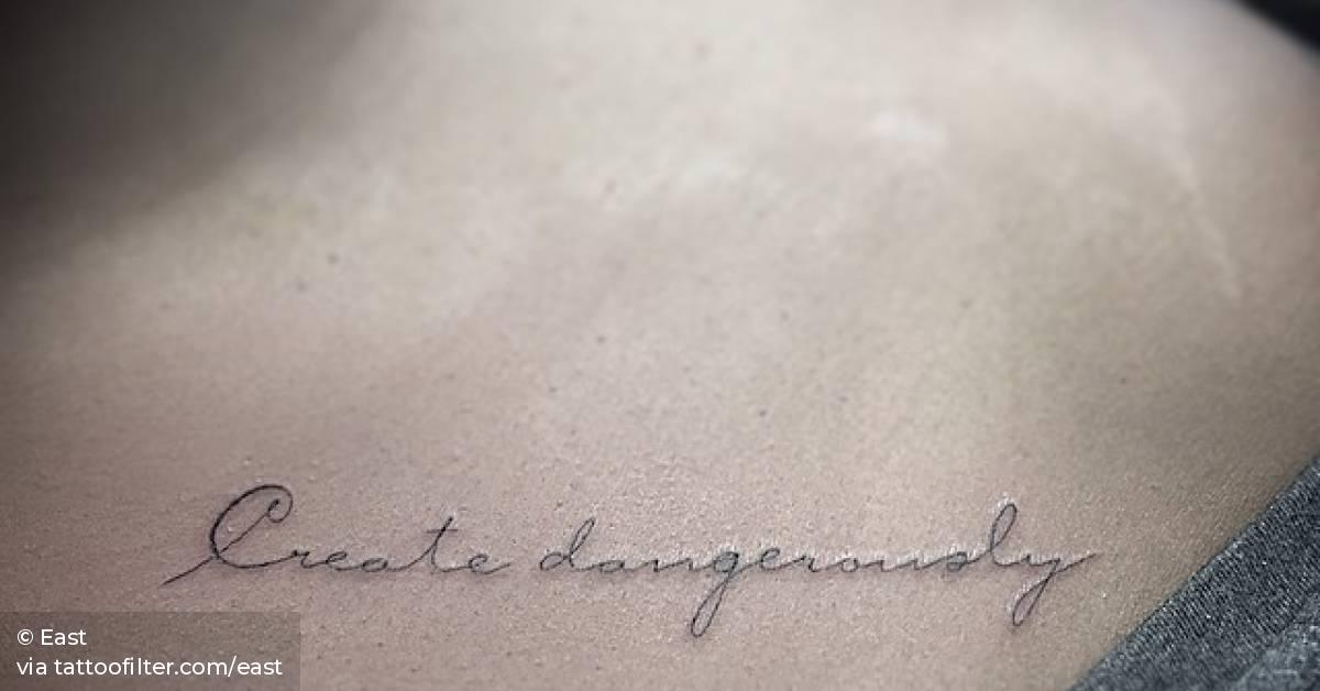 "Create dangerously" tattoo on the left side of the