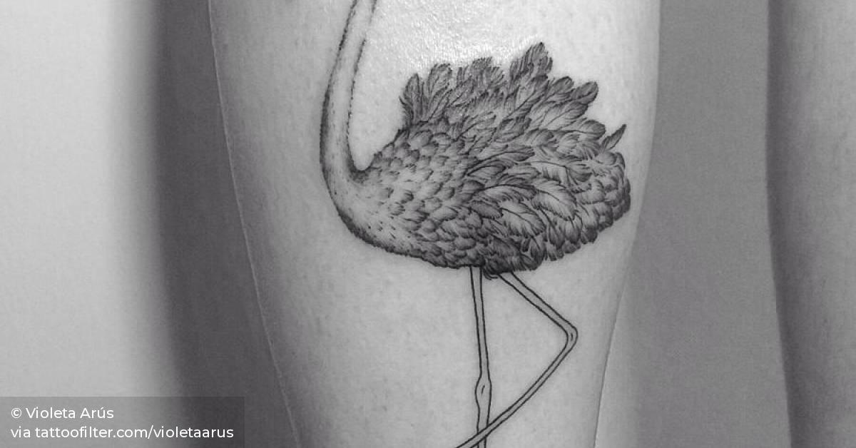 Fine line style flamingo tattoo on the left calf.