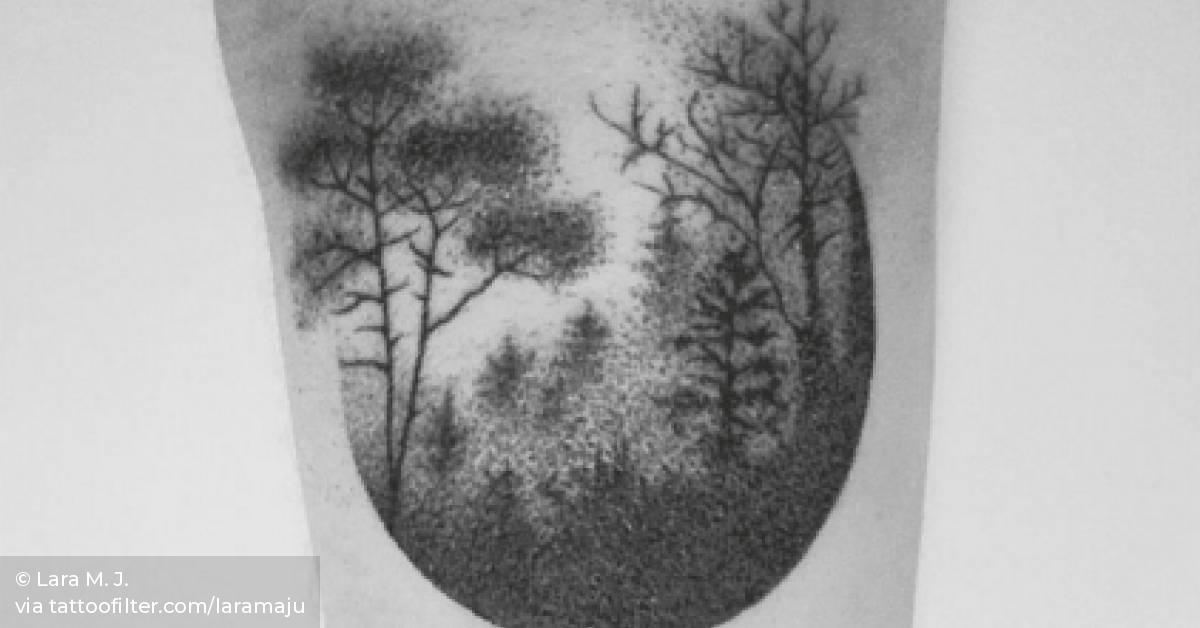 Hand poked forest tattoo on the left forearm.