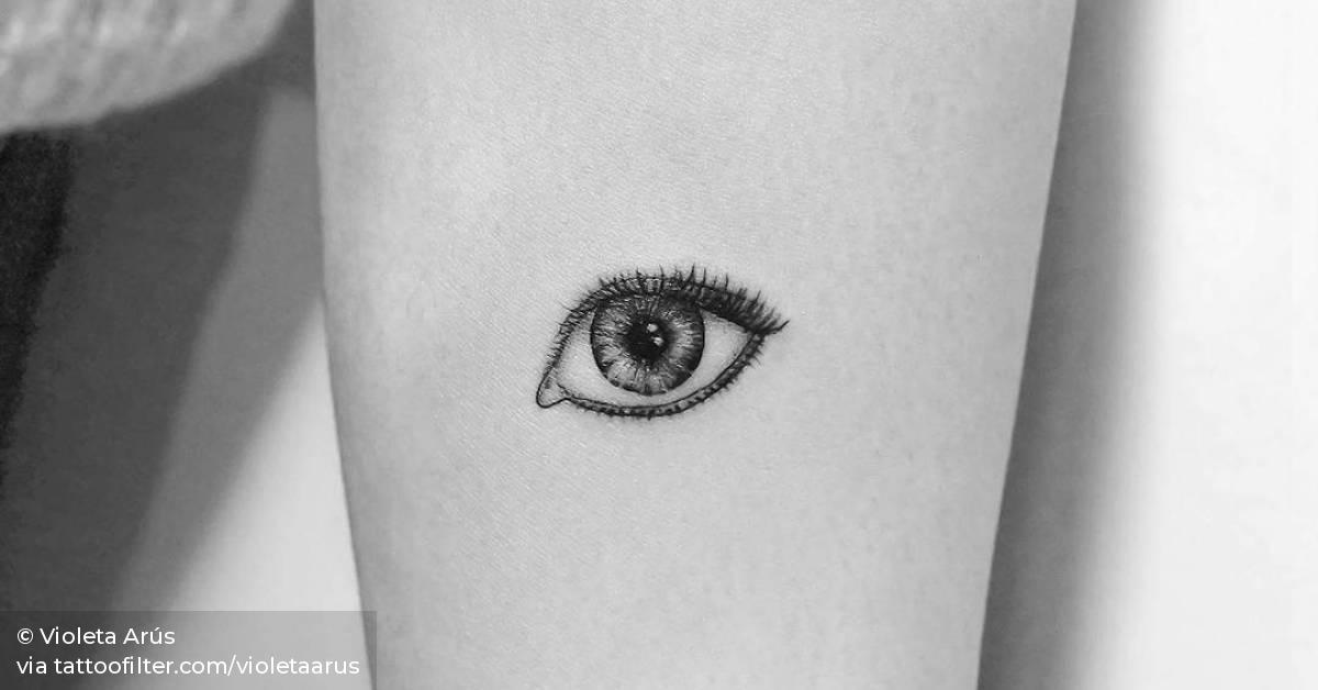 Small fine line style eye tattoo on the forearm.
