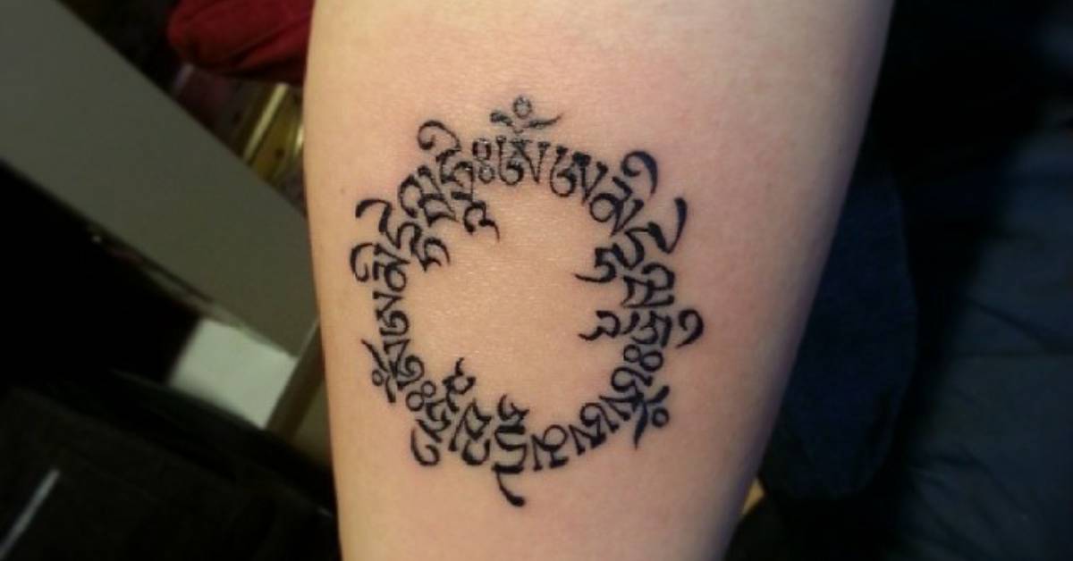 Tibetan tattoo on the right inner forearm.