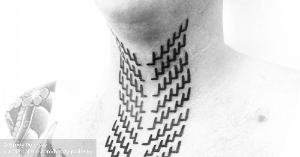Custom pattern tattoo on neck and chest.
