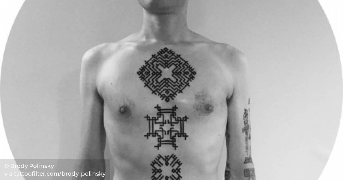 Custom pattern tattoo on chest, sternum and stomach.