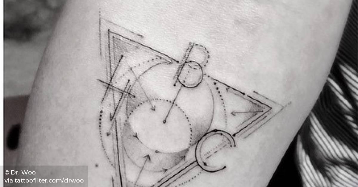 Fine line style triangle tattoo on the right forearm.