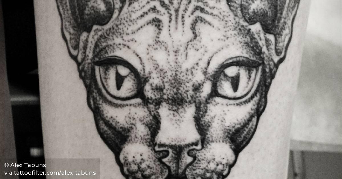 Sphynx tattoo on the left thigh.