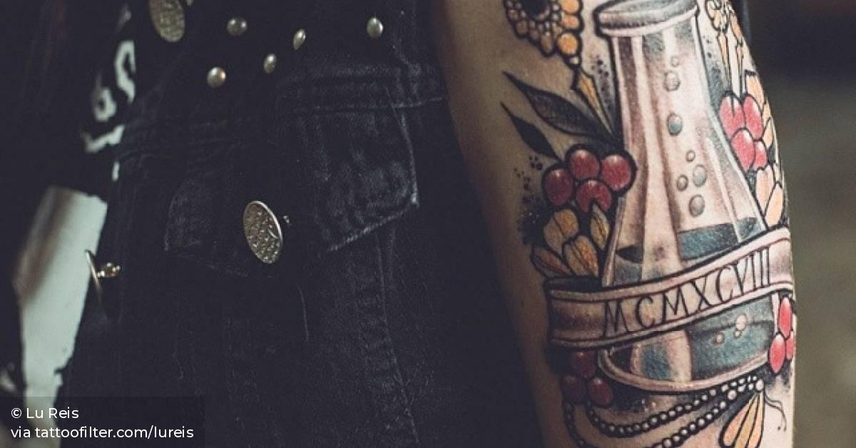 Neotraditional style flask tattoo on the left upper arm