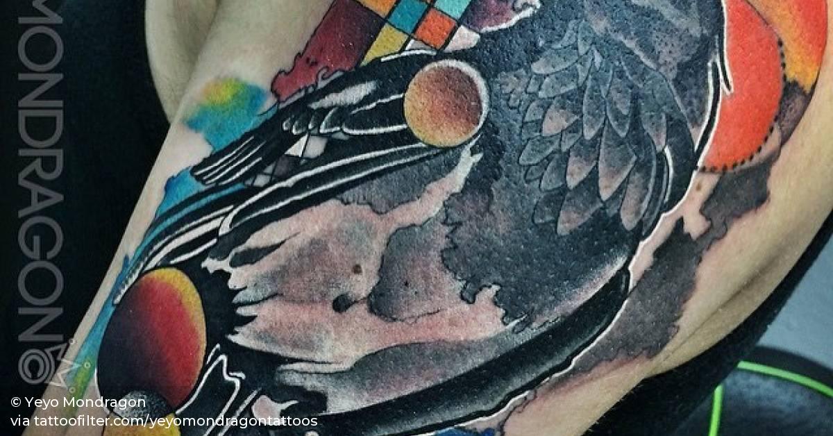 Magpie composition tattoo on the left upper arm and