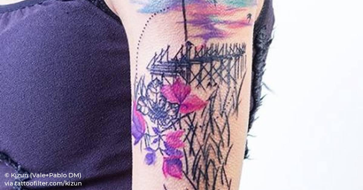 Abstract composition tattoo on the left upper arm and