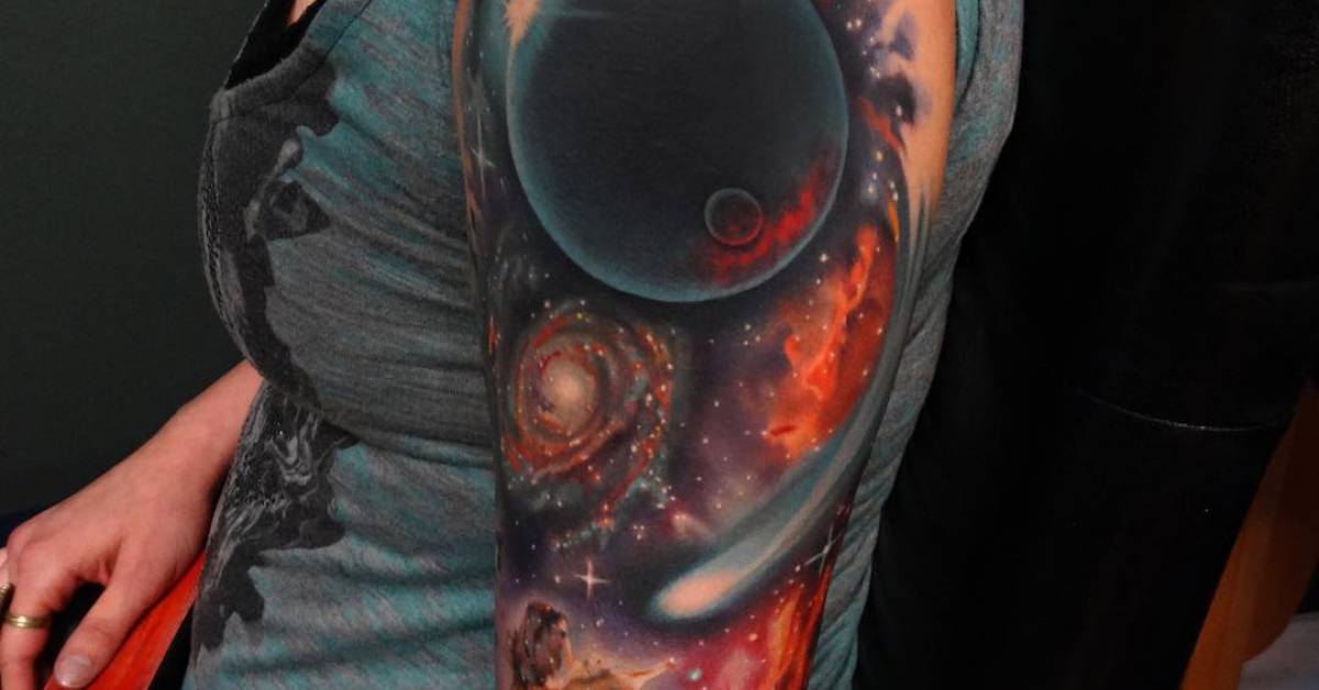 Realistic galaxy half sleeve tattoo.