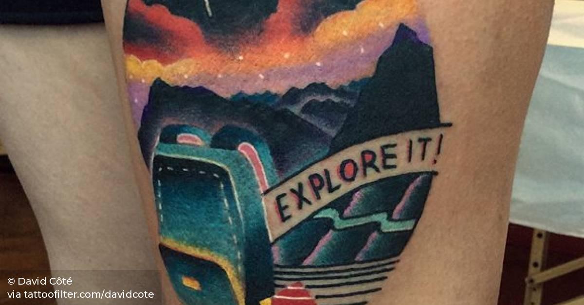 "Explore it!" tattoo on the left thigh.