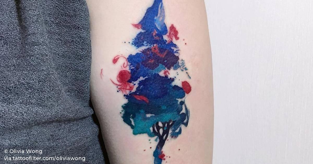 Abstract tree tattoo on the left bicep.