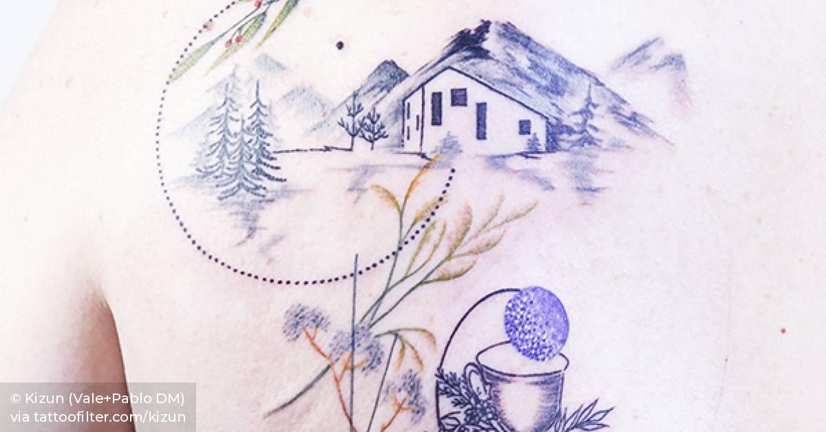 Graphic style landscape tattoo on the back.