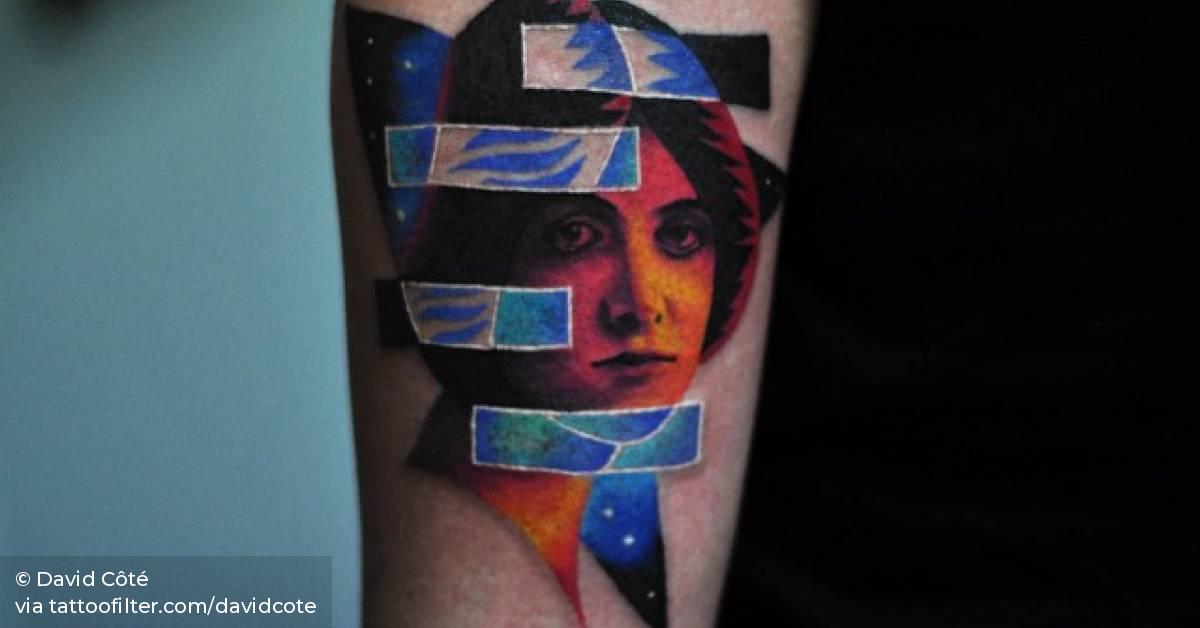 Surrealist portrait tattoo on the right forearm.
