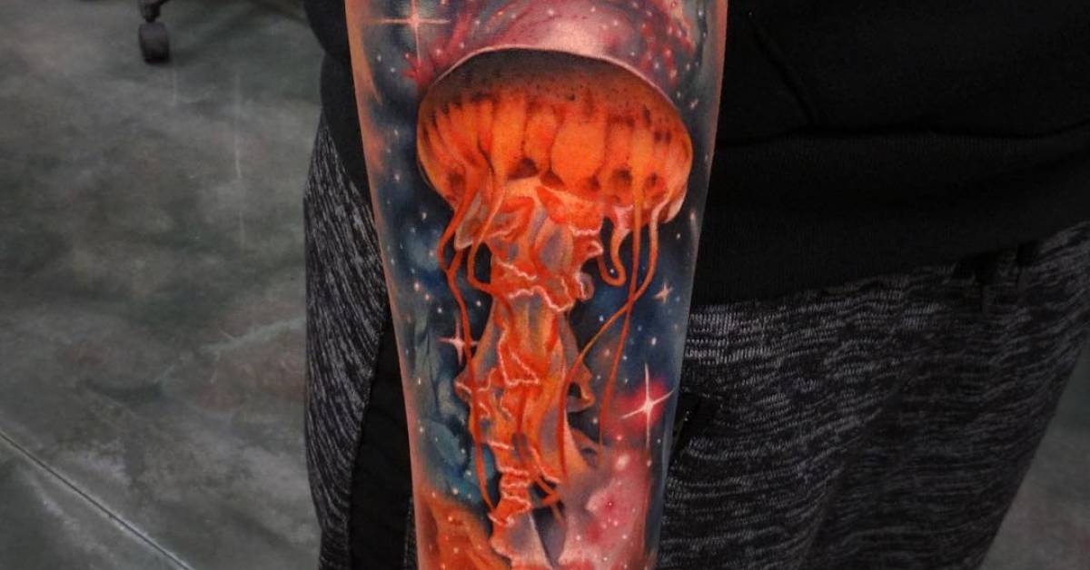 Galactic jellyfish tattoo on the right forearm.