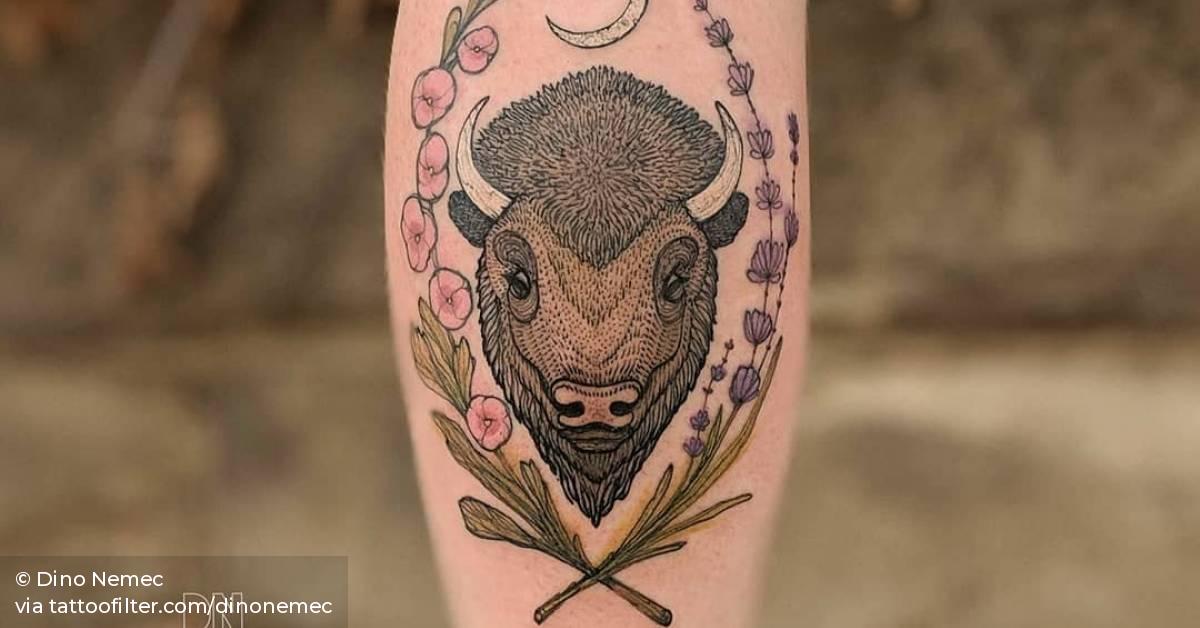 Bison tattoo on the left calf.