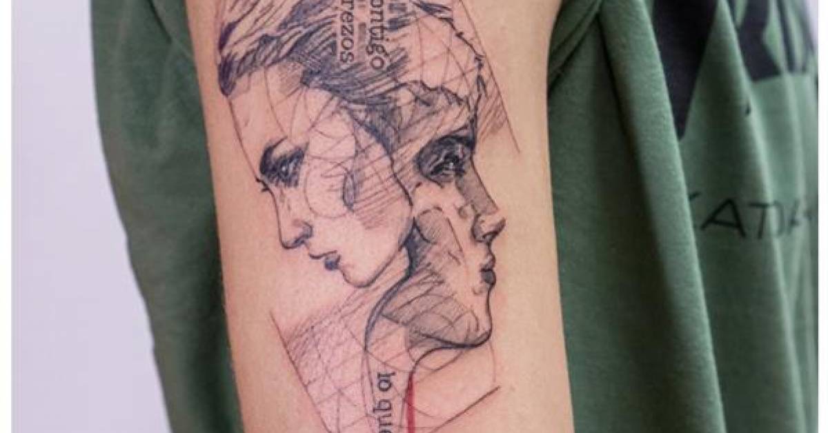 Graphic style right upper arm tattoo including the