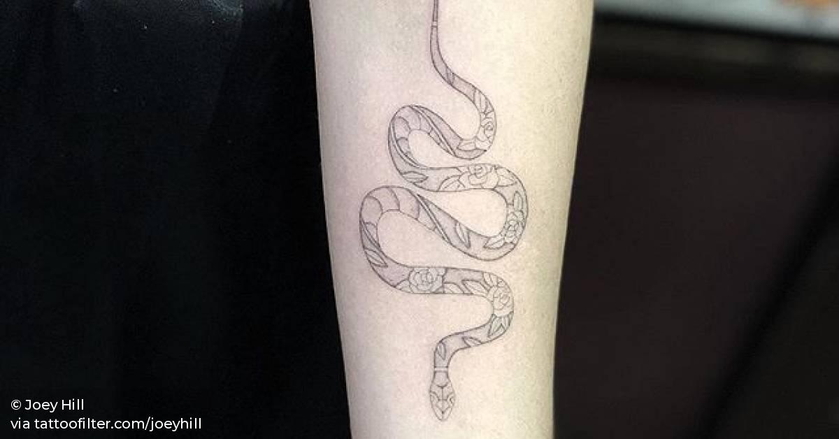 Single needle floral snake on the inner forearm.