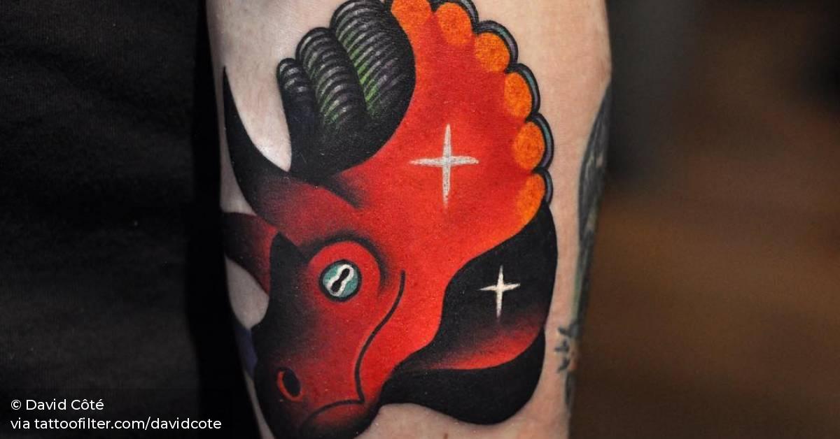 Psychedelic triceratops tattoo on the left inner