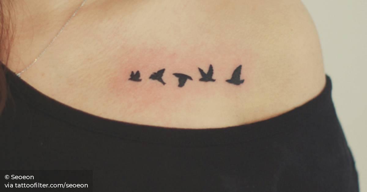 Five flying birds on the shoulder by Seoeon.