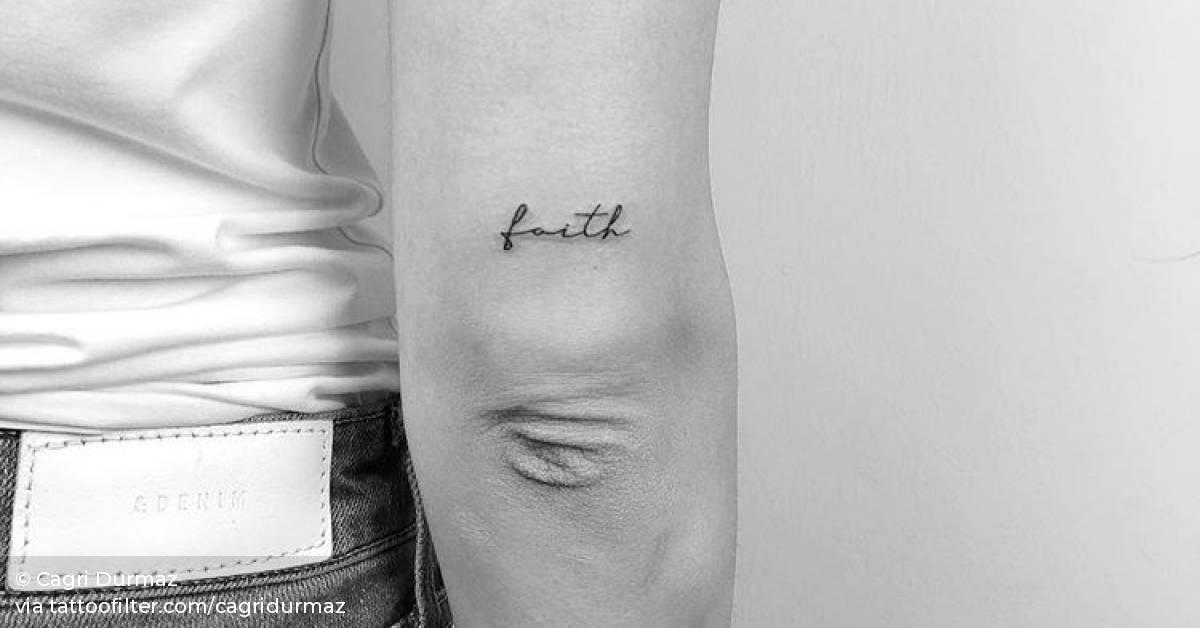 “Faith” tattoo on the back of the right arm.